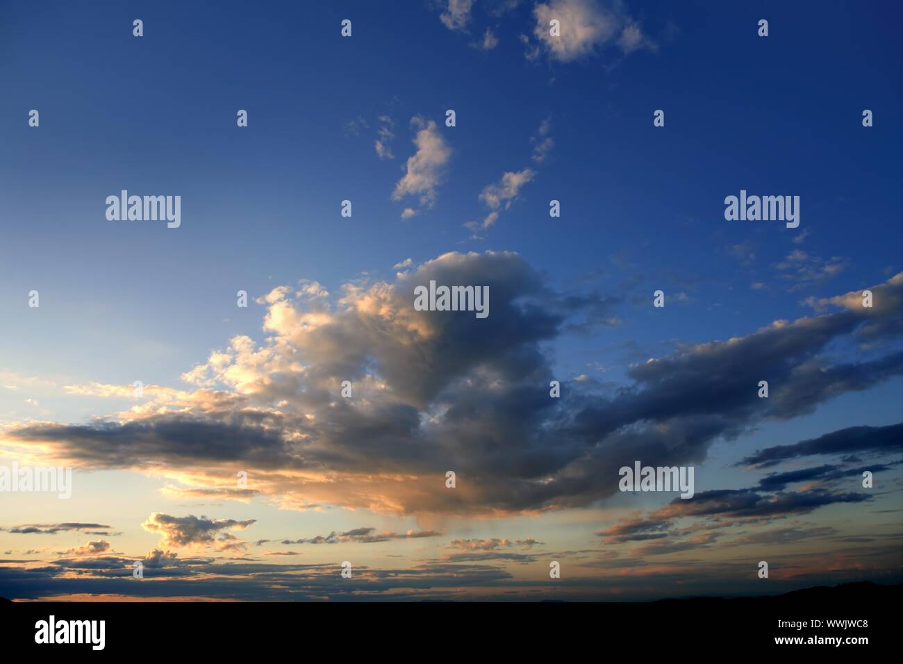 blue red sunset sky background stormy clouds Stock Photo - Alamy