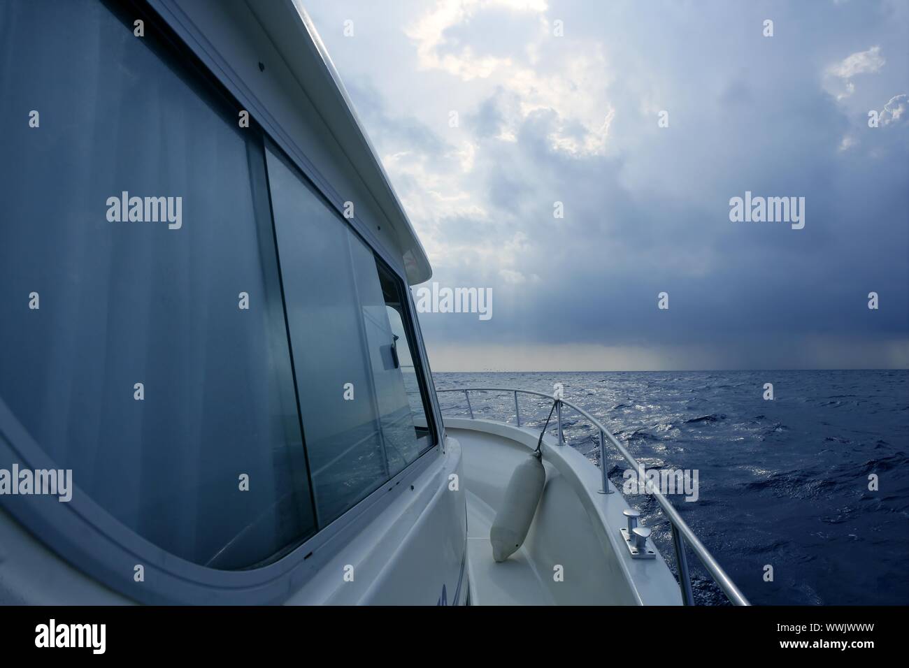 Water splash at the starboard boat side on blue ocean sea Stock Photo ...
