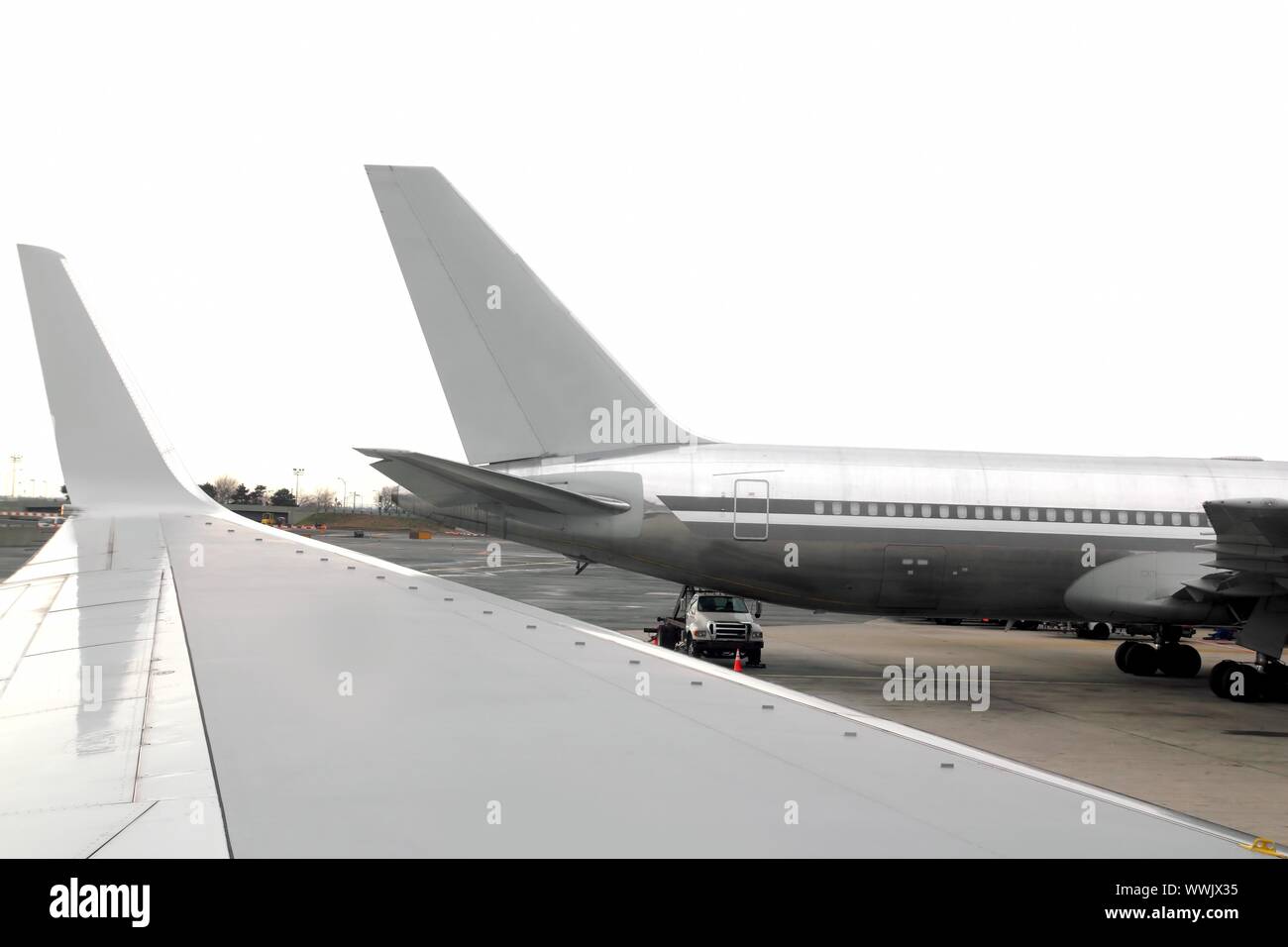aircraft landed with side wing perspective in airport Stock Photo - Alamy