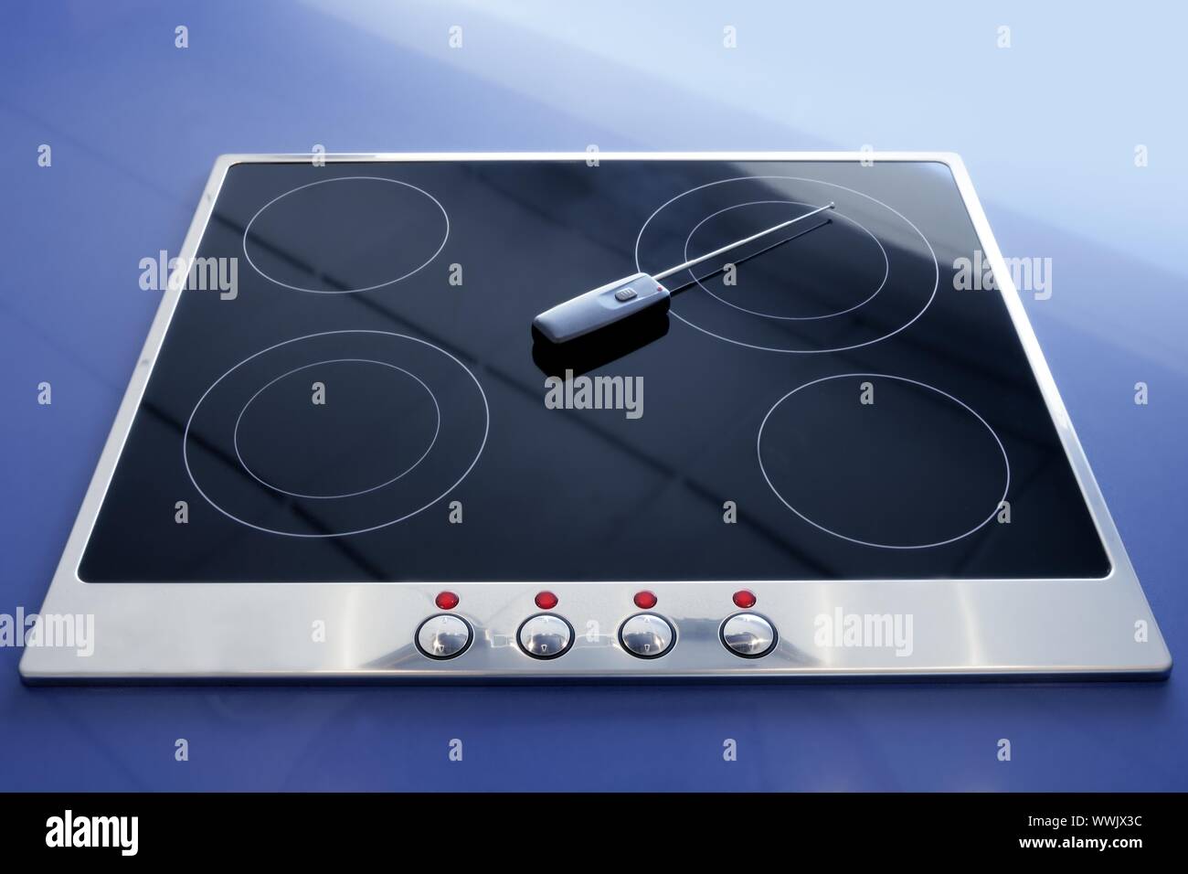 Stove vitroceramic electric fire kitchen wireless on blue kitchen Stock ...