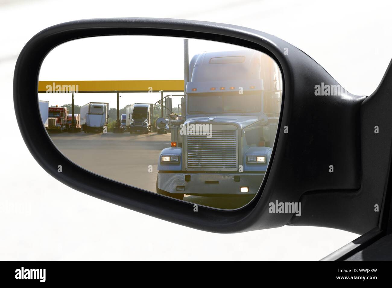 rearview car driving mirror overtaking big truck lorry Stock Photo - Alamy