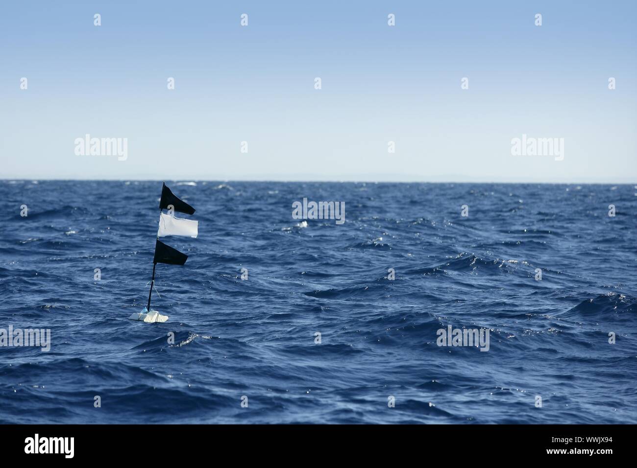 Blue ocean with longline flag fishing floating beacon in Spain Stock ...
