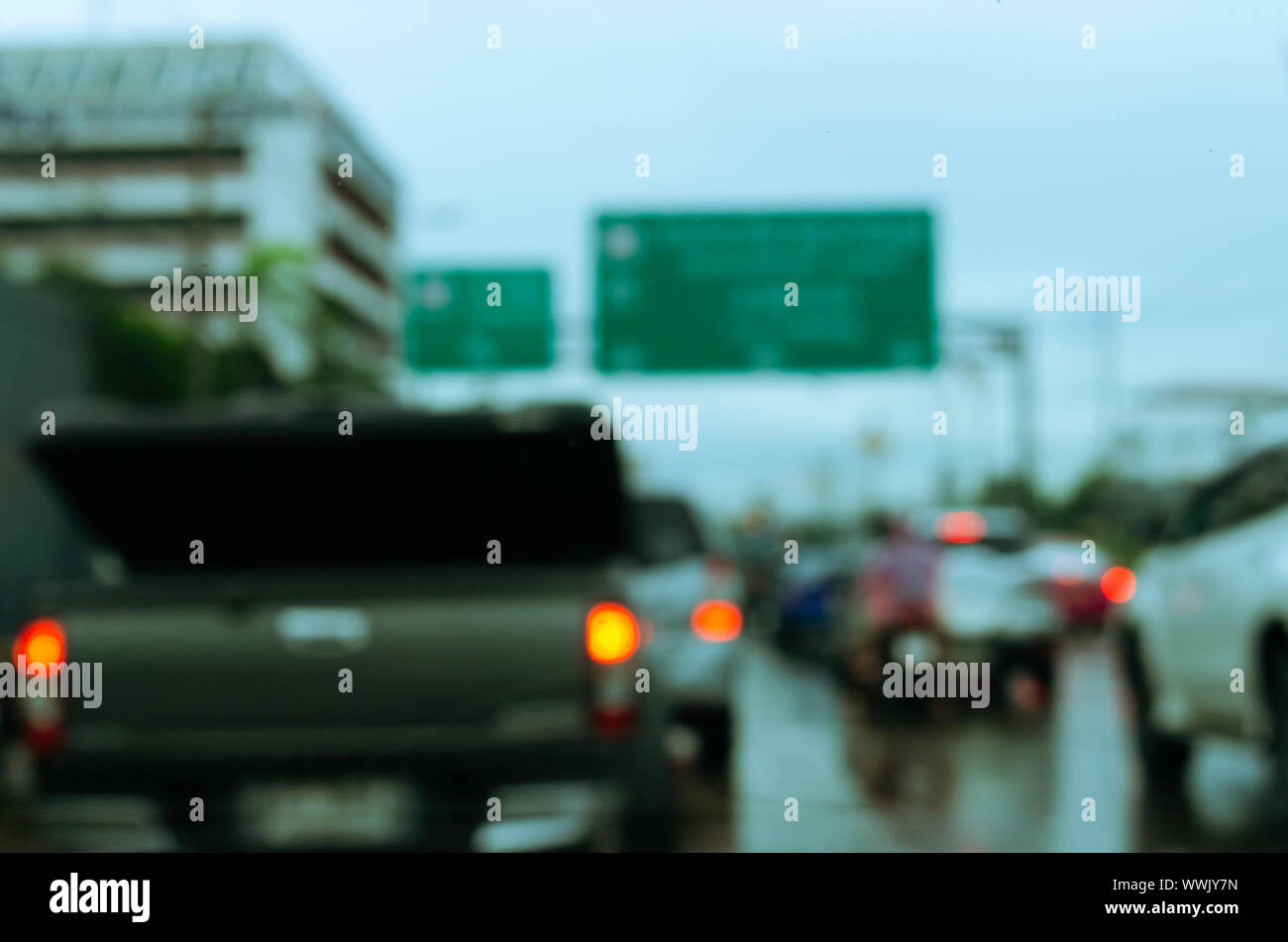 car window with rain drops driving in rain.Traffic jam background ...