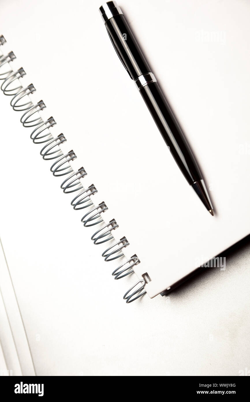 Address book with metal spiral, white paper Stock Photo - Alamy