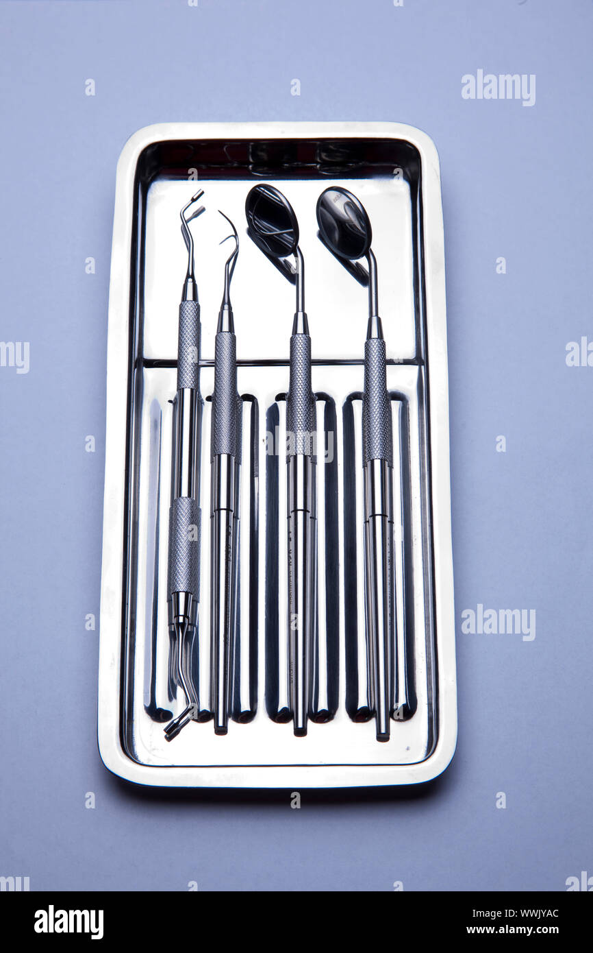 Dental Instruments - angled mirrors, plate, tools Stock Photo - Alamy