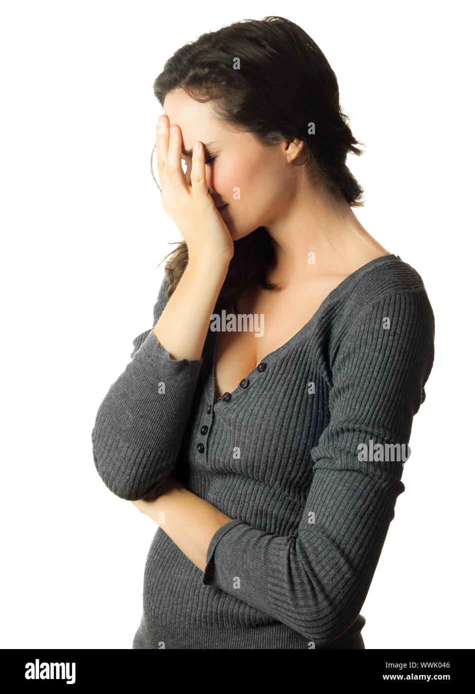 A very sad and depressed woman hiding her face in her hands Stock Photo ...