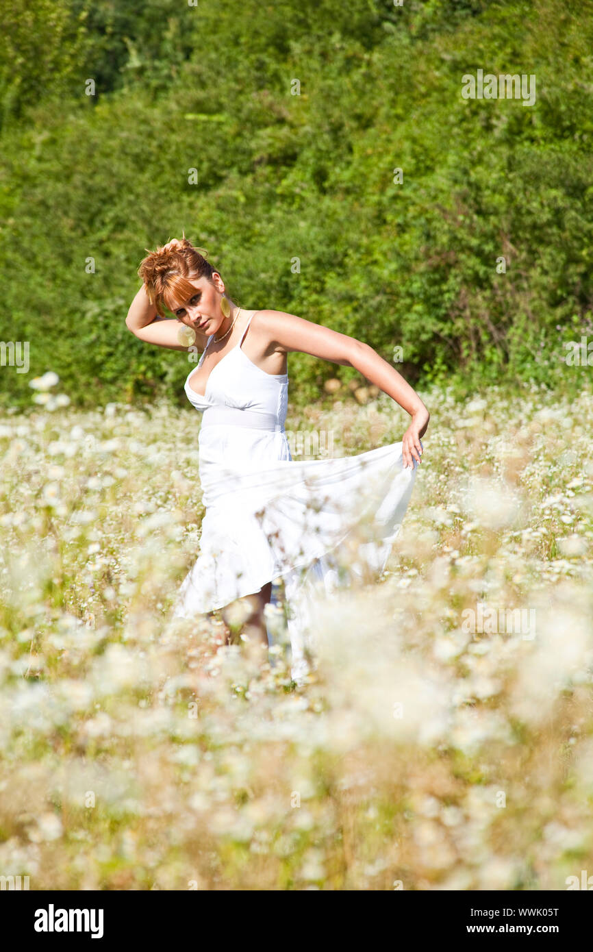 Woman In White Dress Dancing In Nature Stock Photo - Alamy