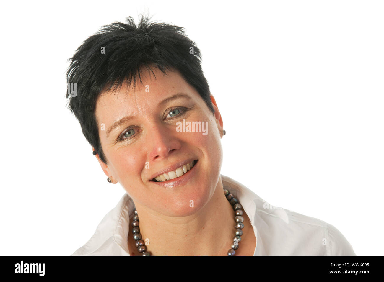 Young woman friendly smiling as studio portrait Stock Photo - Alamy