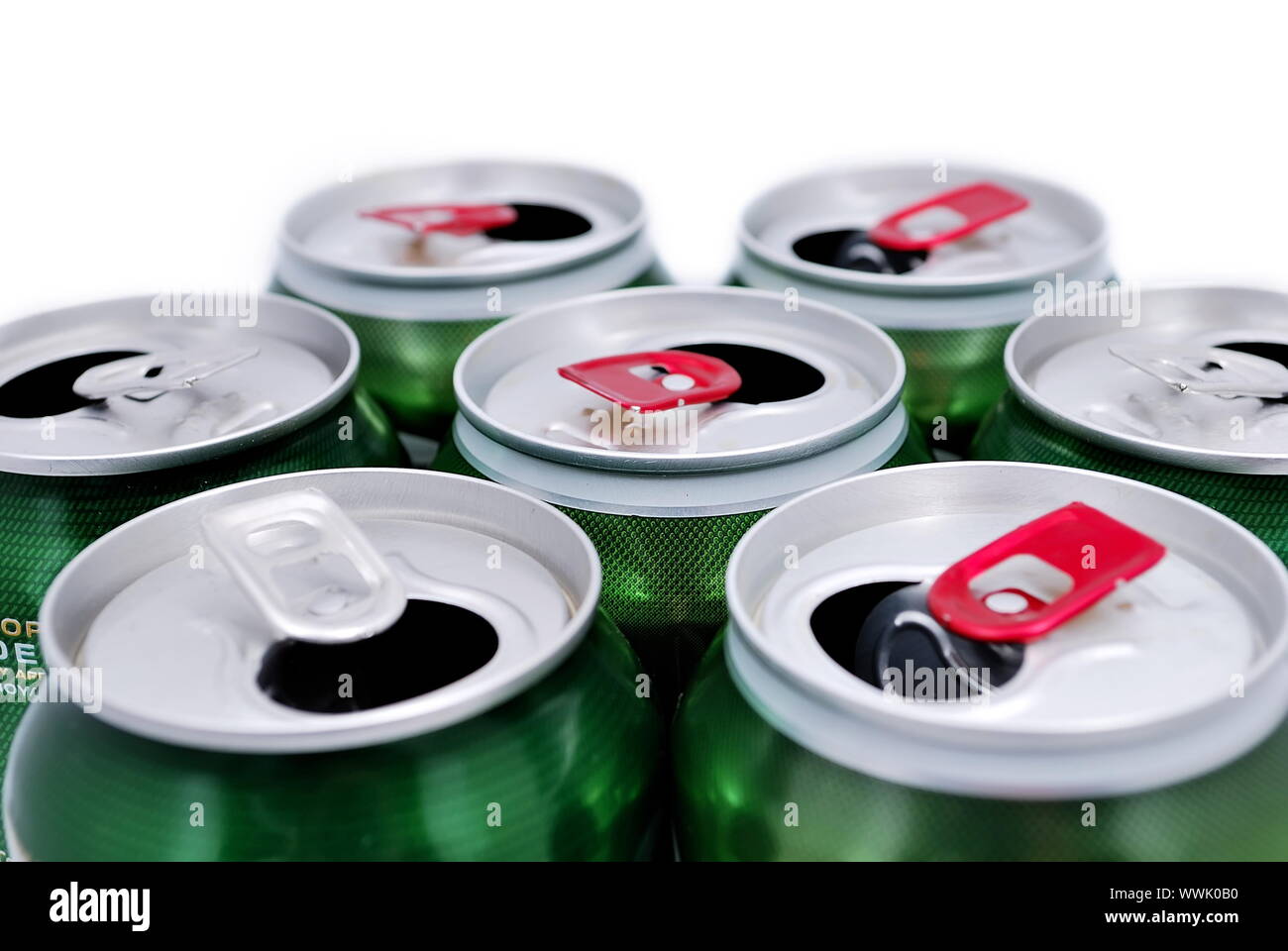 seven open beer cans on a white background Stock Photo - Alamy
