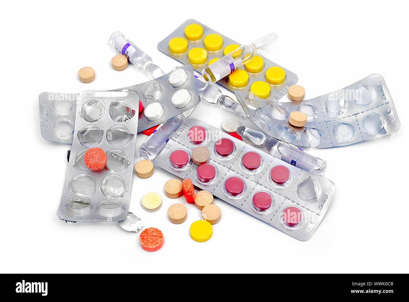 dispersal tablets and capsules on white background Stock Photo - Alamy