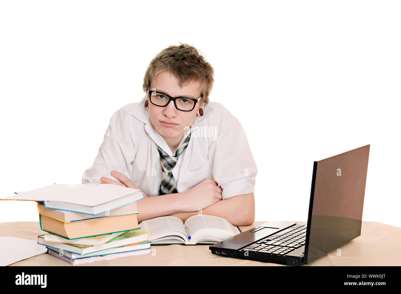 teenager student sits behind a desk isolated on white background Stock ...