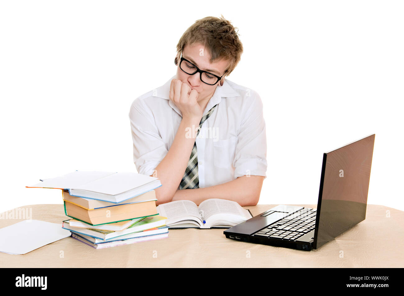 teenager student sits behind a desk isolated on white background Stock ...