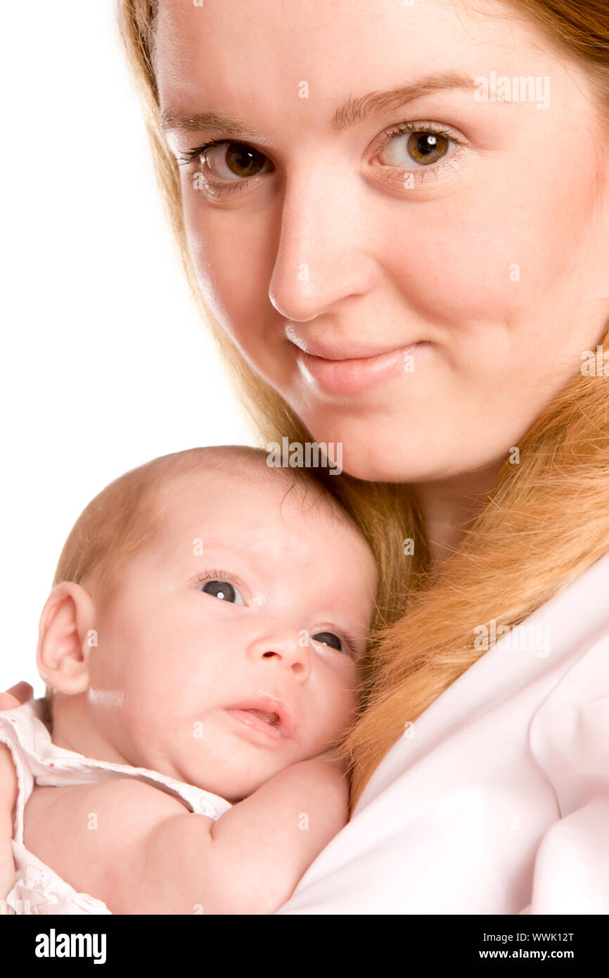 Happy mother holding her baby both smiling Stock Photo - Alamy
