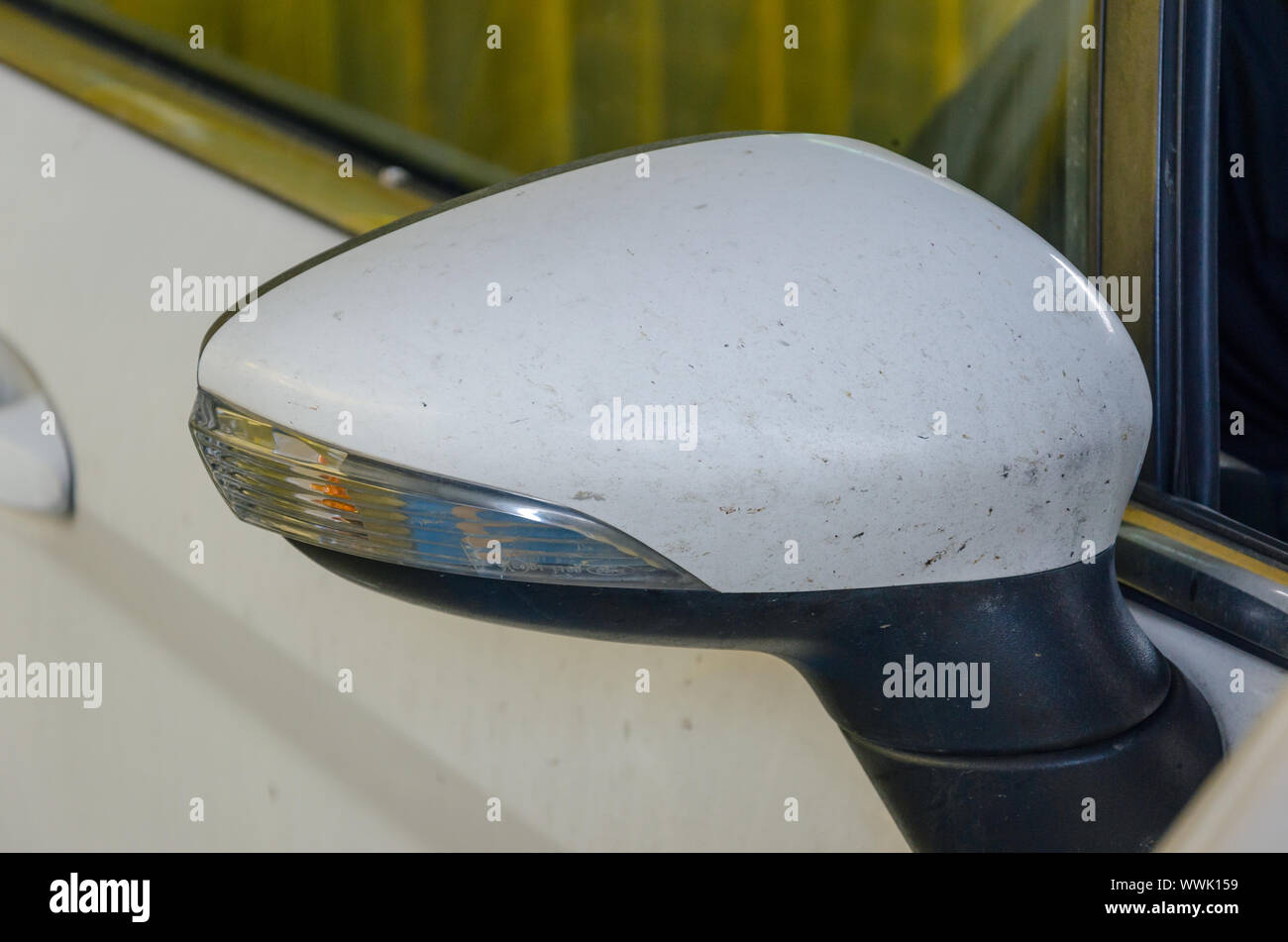 White car is dirty and the dust is on the side mirror Stock Photo - Alamy