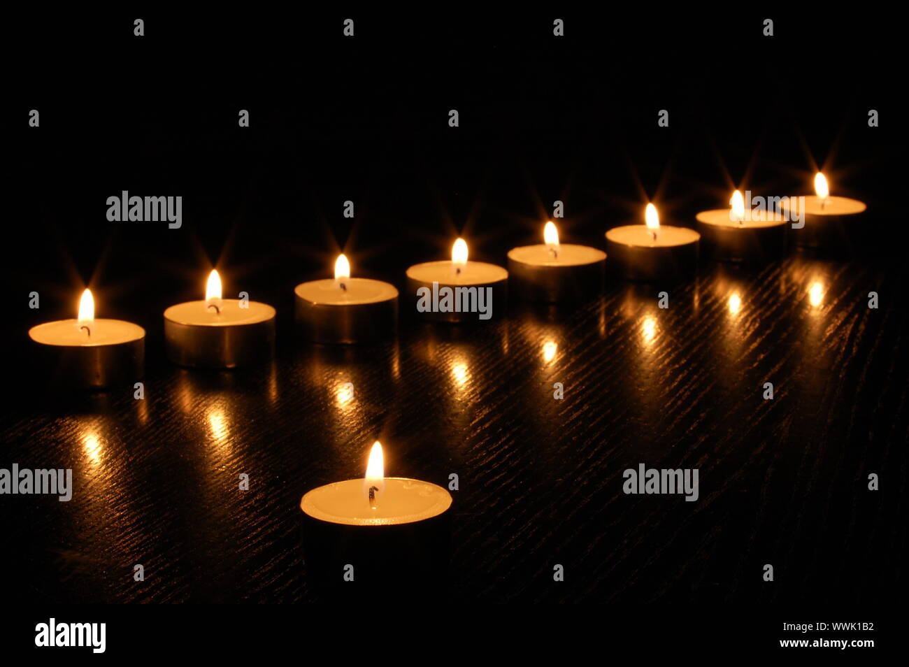 romantic hot candle light on black background Stock Photo - Alamy