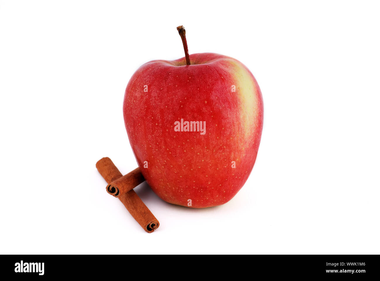 red apple with cinnamon on a white background Stock Photo - Alamy