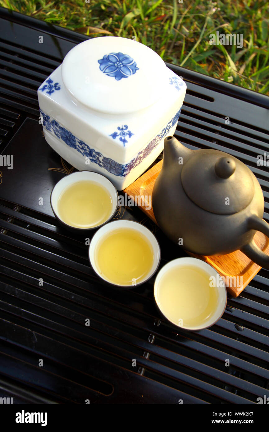 Chinese tea set under sunlight Stock Photo - Alamy