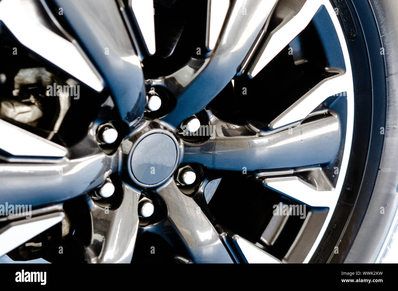 Close up of rims alloy wheels Stock Photo - Alamy