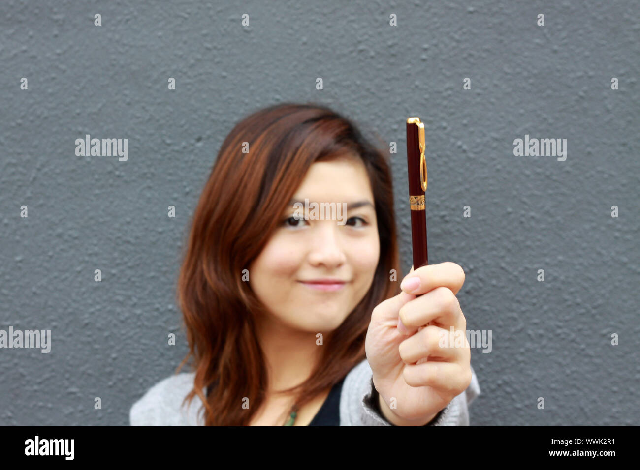 Asian woman with an idea Stock Photo - Alamy