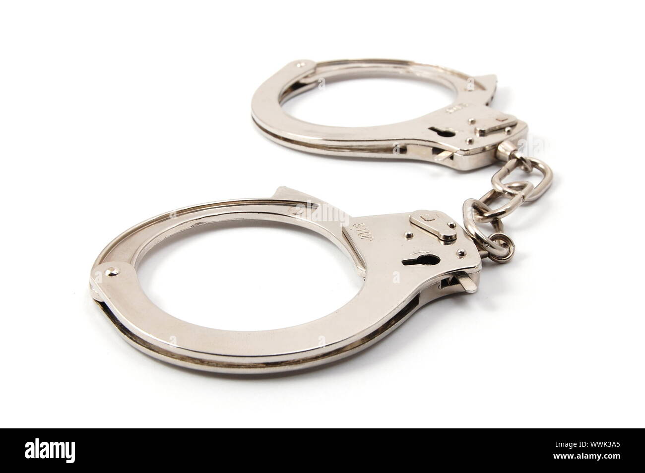 police handcuffs isolated on a white background Stock Photo - Alamy