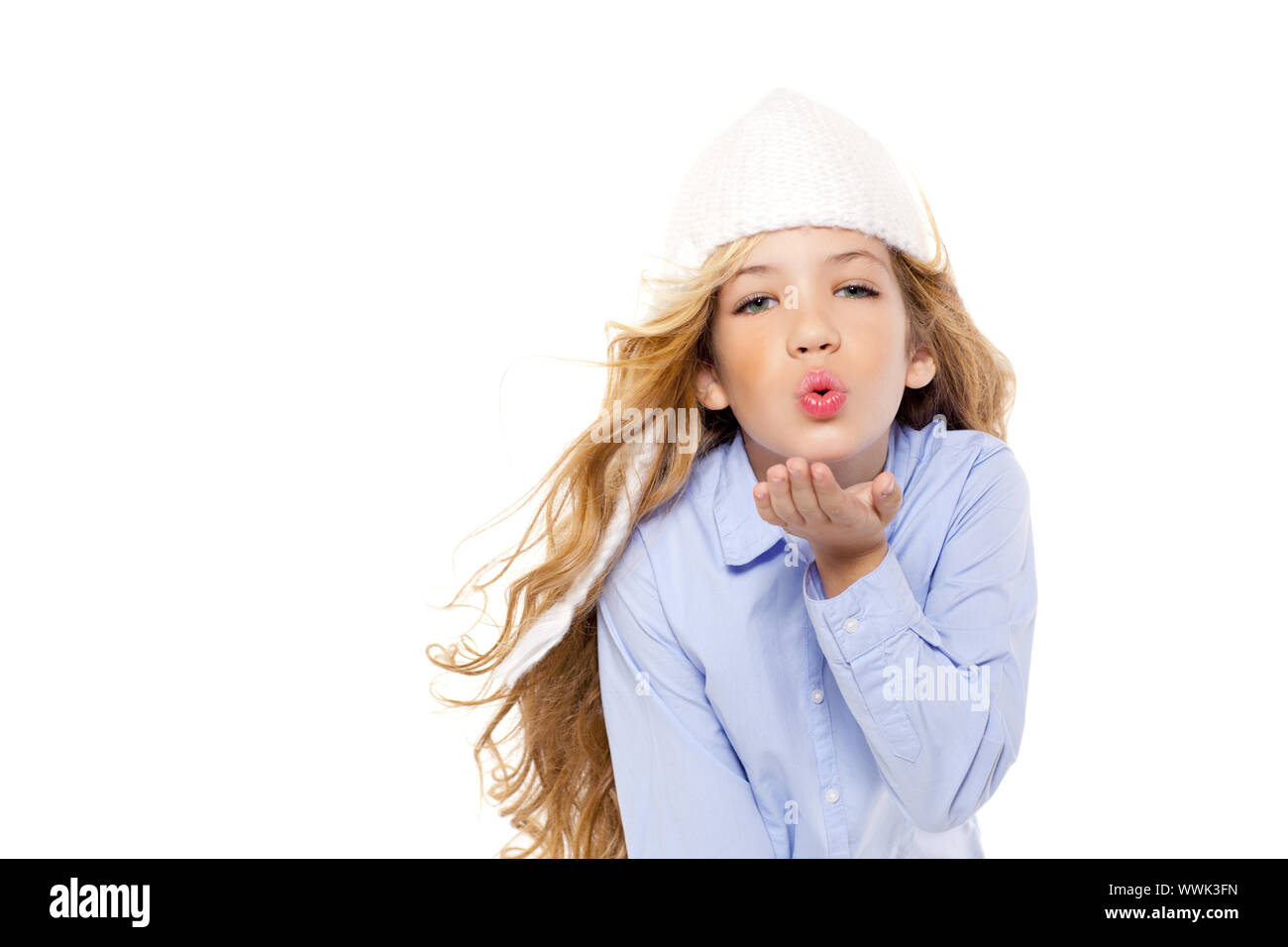beautiful winter kid girl blowing wind with lips isolated on white ...