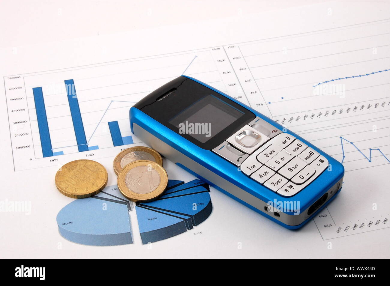 blue cell phone over business chart showing success Stock Photo - Alamy