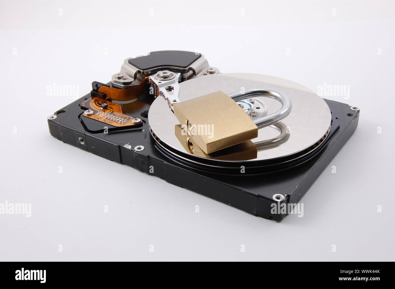computer hard disk drive and a padlock isolated on white background ...