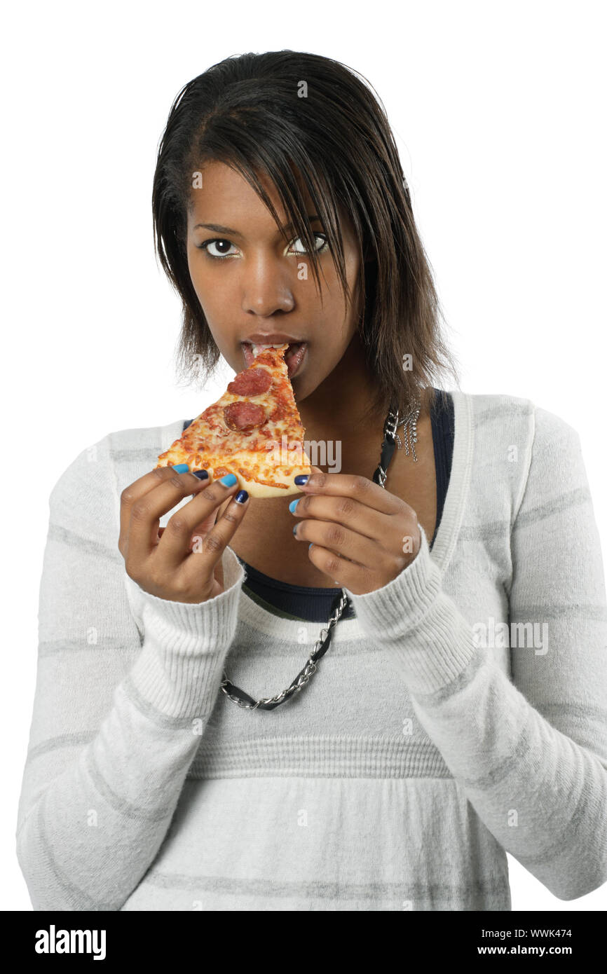An attractive female eating a slice of pepperoni pizza Stock Photo - Alamy