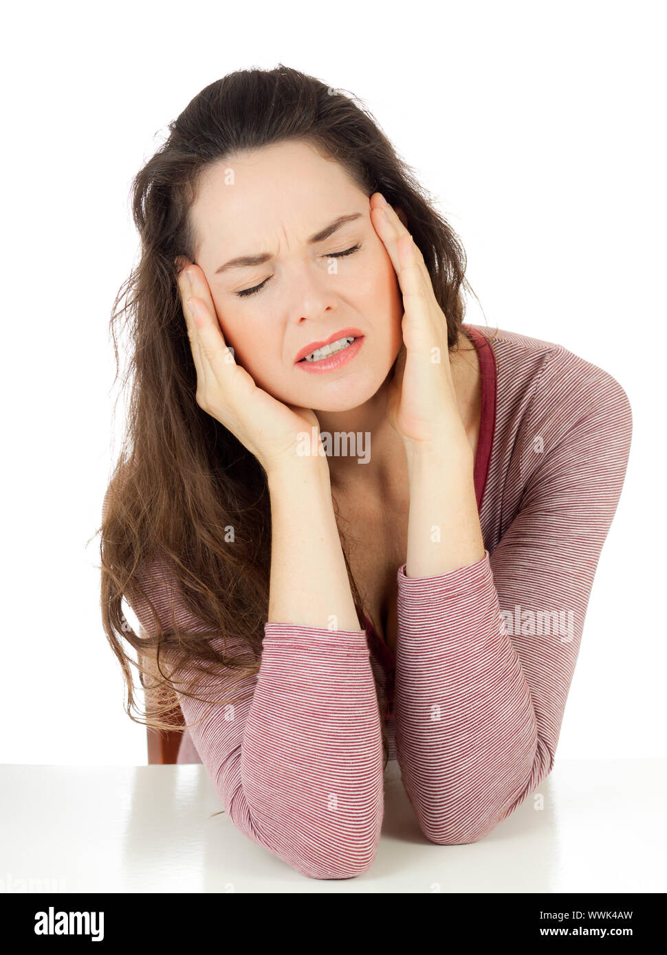 Beautiful young woman with a bad headache touching her head. Isolated ...