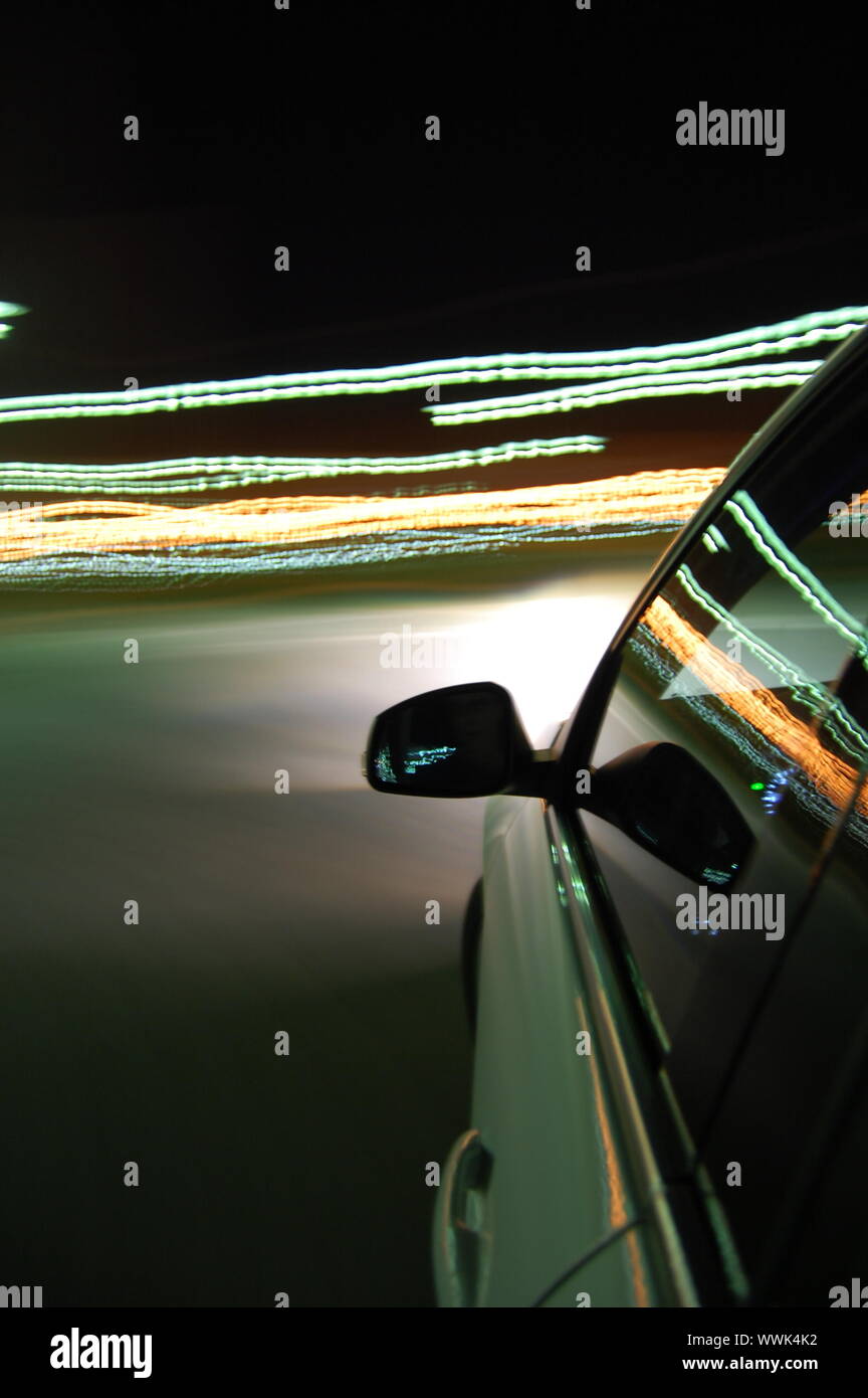 night drive with car in motion through the city shows the speed Stock ...