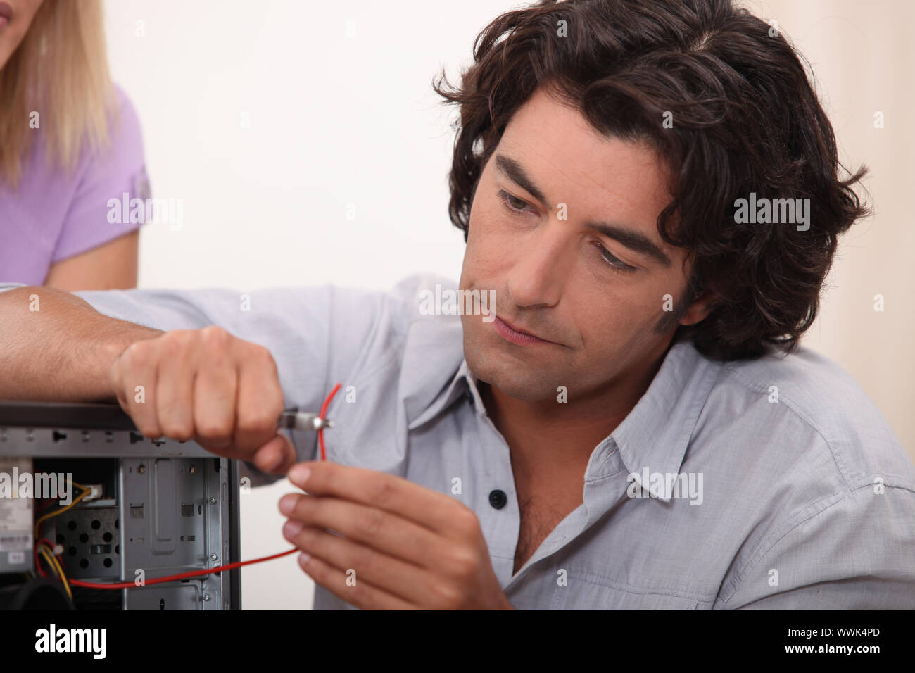 Man fixing a hard drive Stock Photo - Alamy