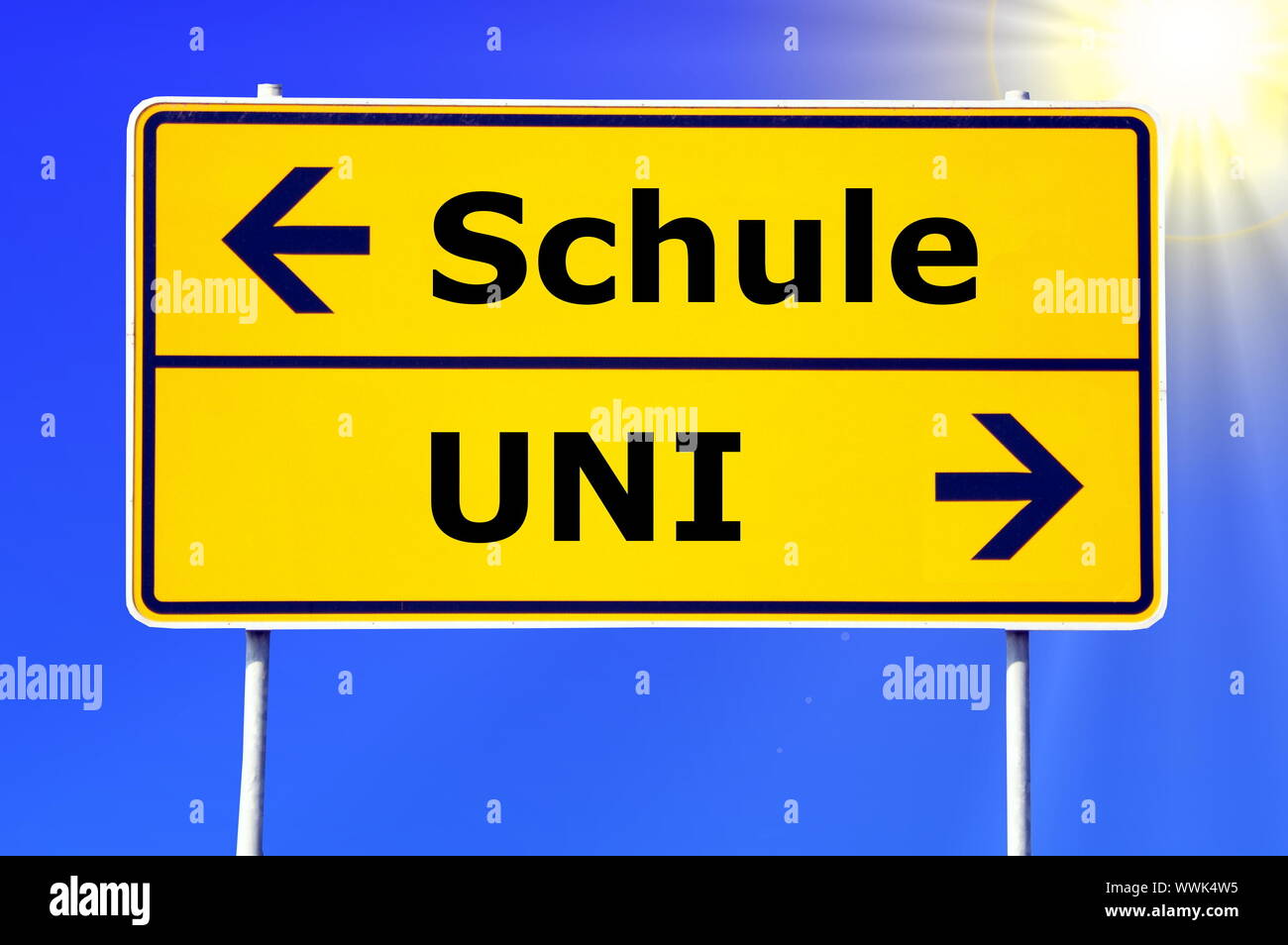 school and university education concept with yellow road sign Stock ...