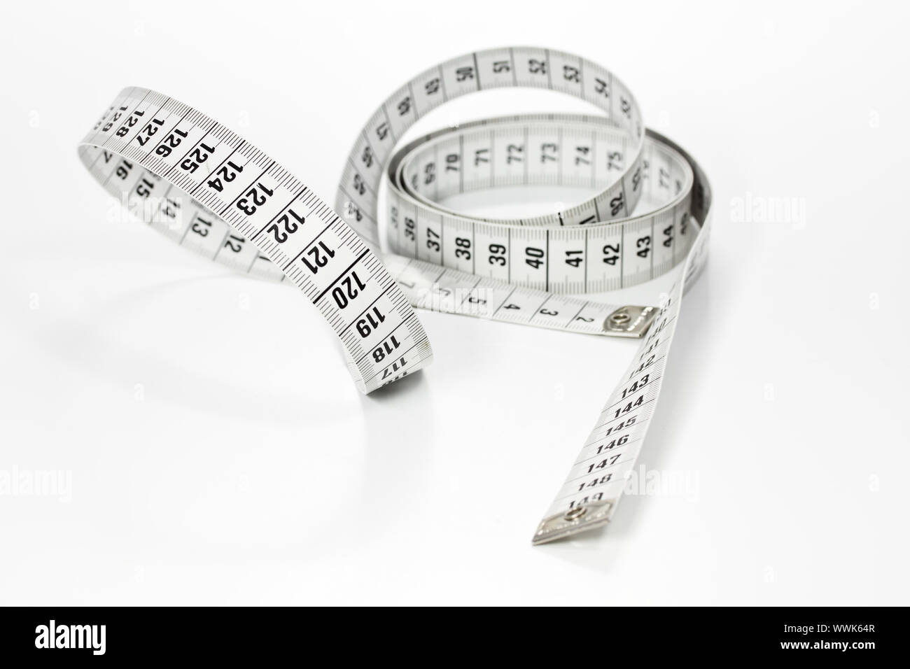 Measuring tape on white background Stock Photo - Alamy