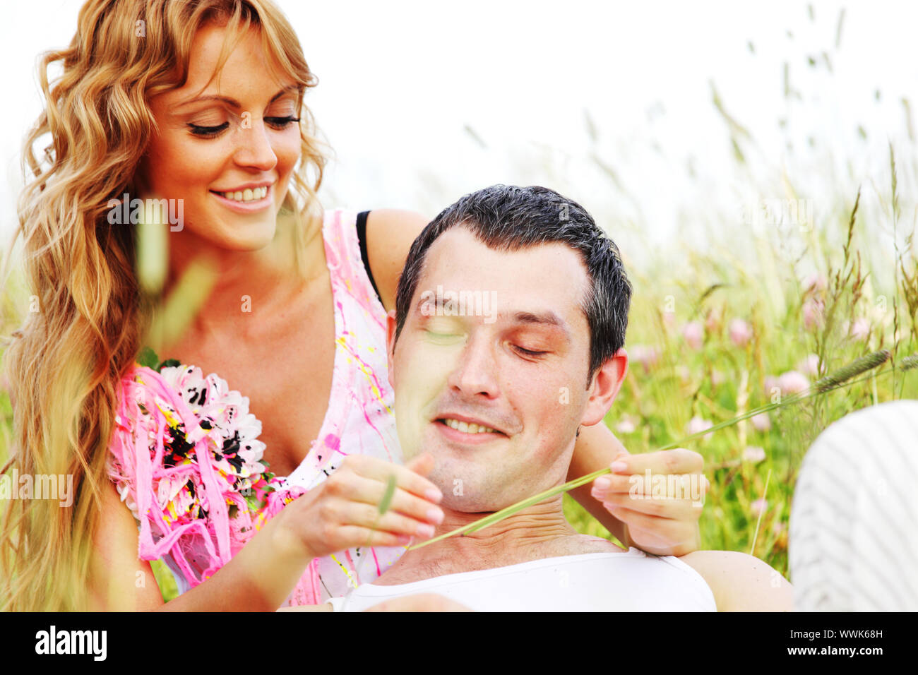 two lovers on grass field Stock Photo - Alamy
