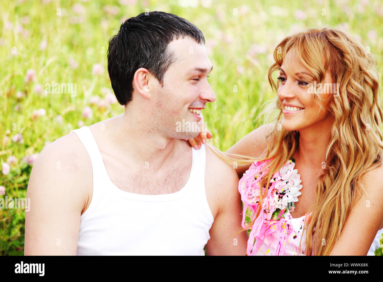 two lovers on grass field Stock Photo - Alamy