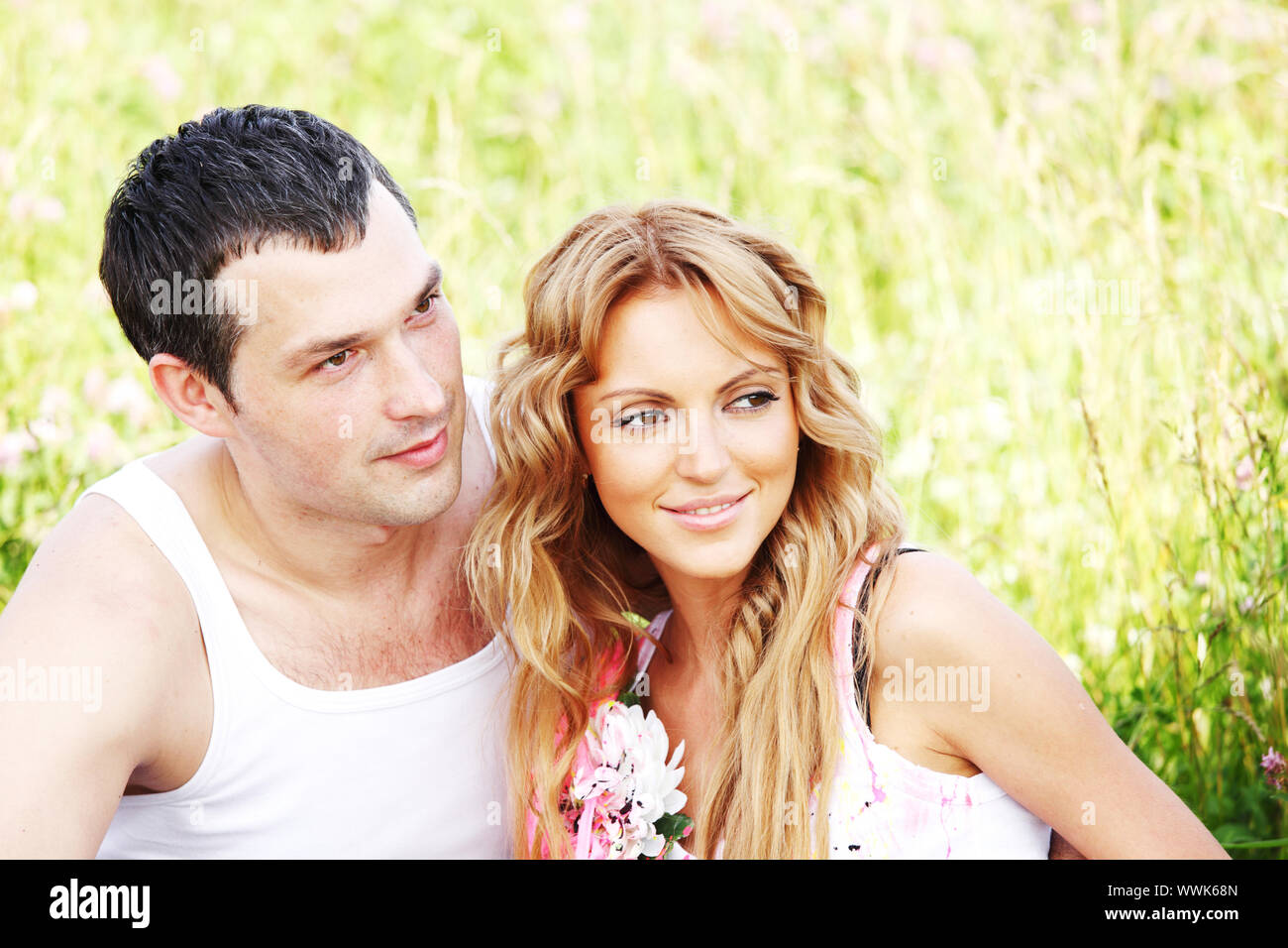 two lovers on grass field Stock Photo - Alamy