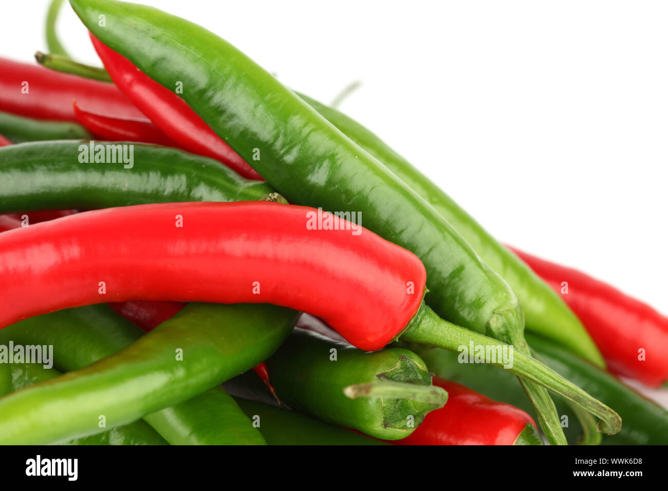 mixed chilli pile isolated on white Stock Photo - Alamy