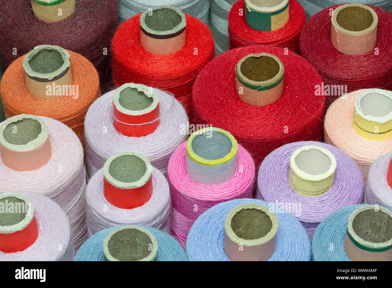 Coloured yarn reels Stock Photo - Alamy