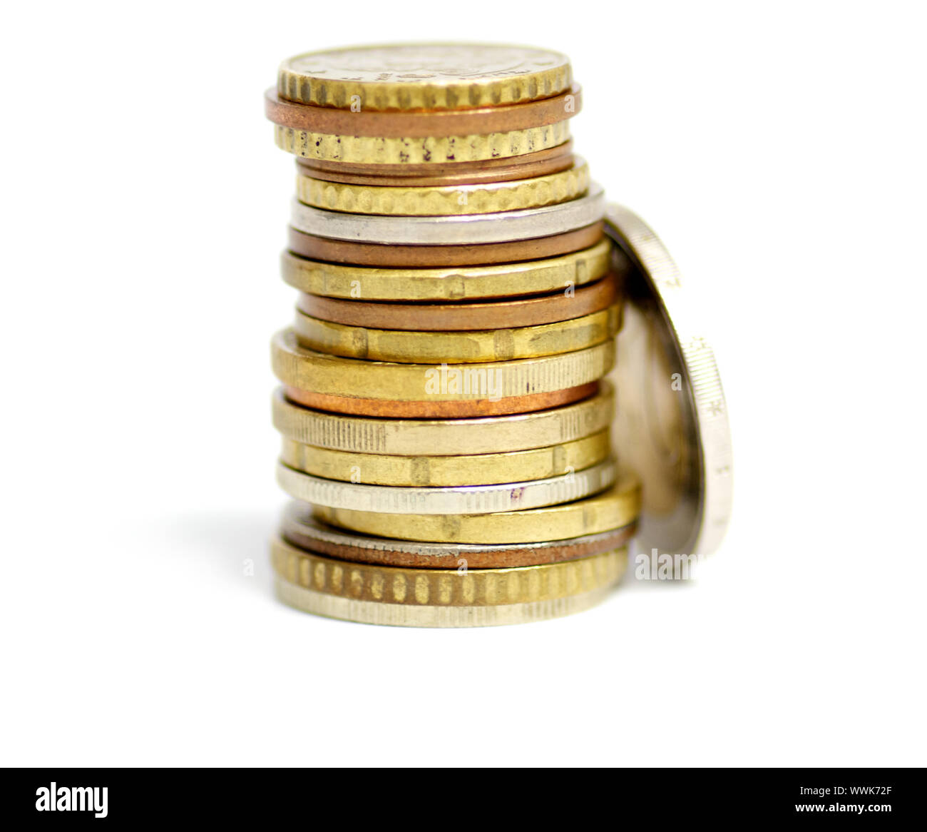 Coin pyramid isolated on white background Stock Photo - Alamy