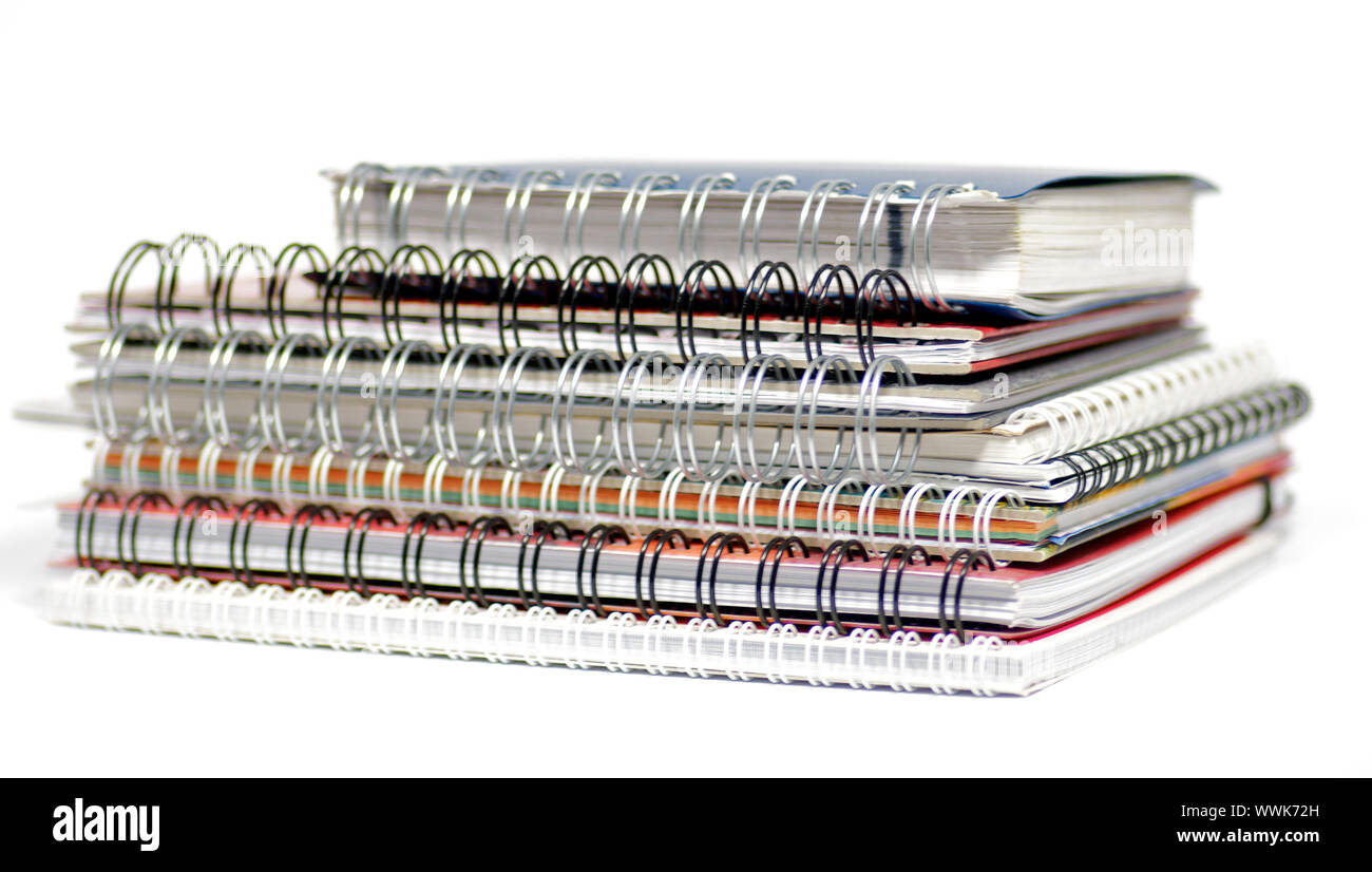 Multi colored Spiral notepads on white background background Stock ...