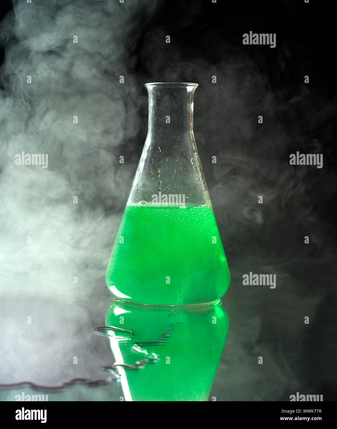 Laboratory Glass with green liquid Stock Photo - Alamy
