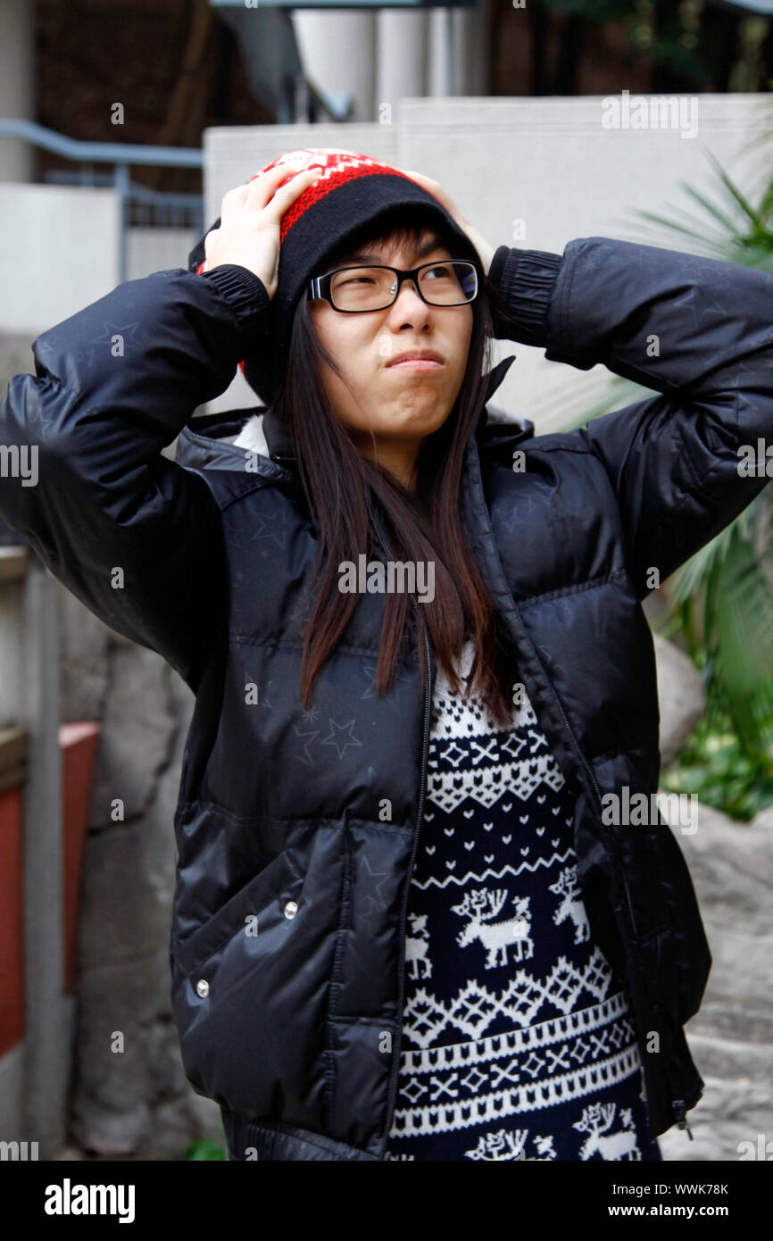 Chinese girl thinking Stock Photo - Alamy