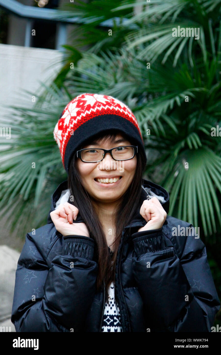 Chinese girl smiling happily Stock Photo - Alamy