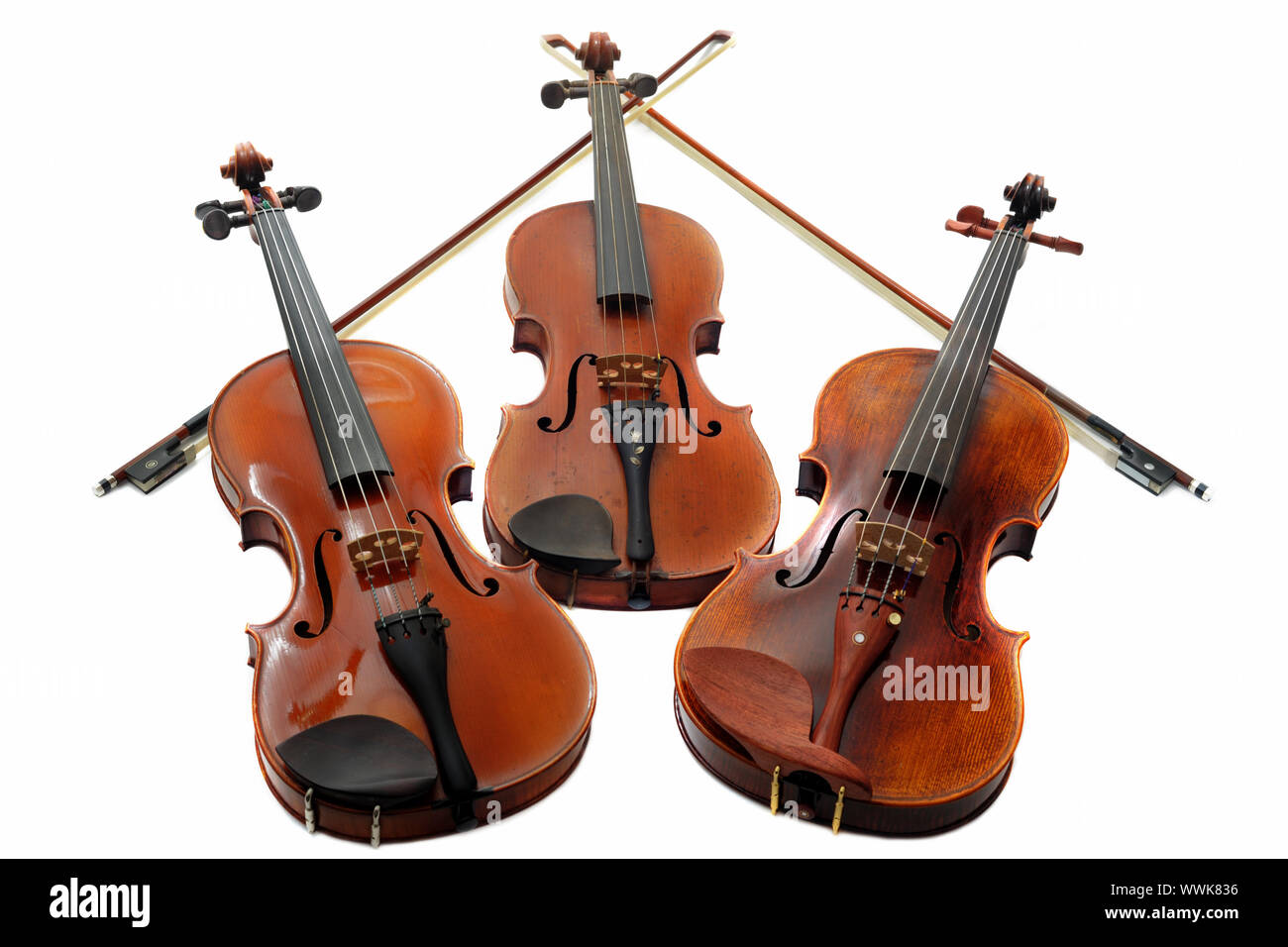 beautiful three violins isolated on a white background Stock Photo - Alamy