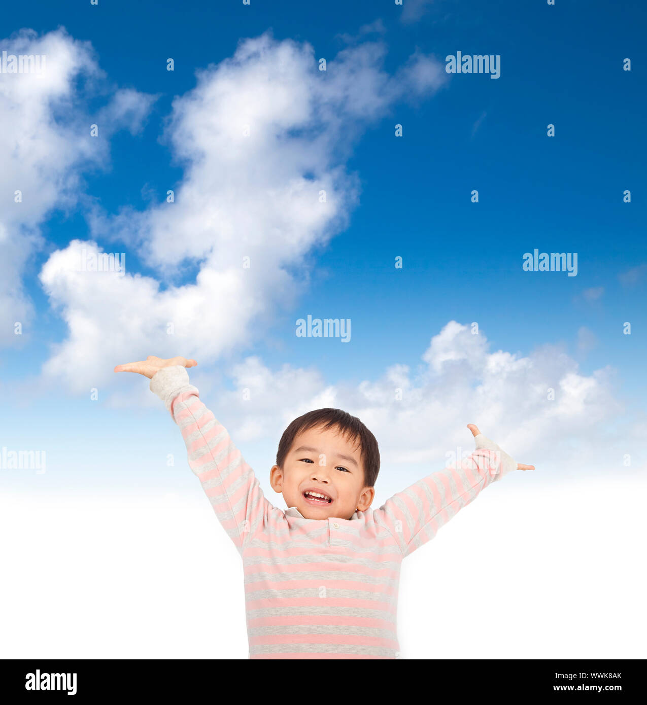 asian kid raising hands with sky background Stock Photo - Alamy