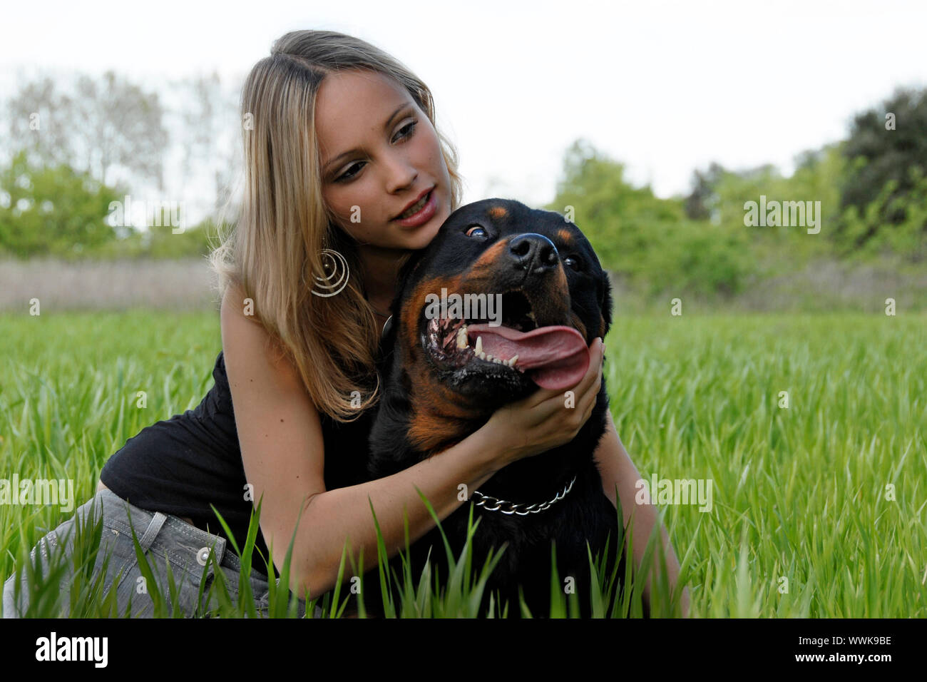portrait of a purebred rottweiler and young woman Stock Photo - Alamy