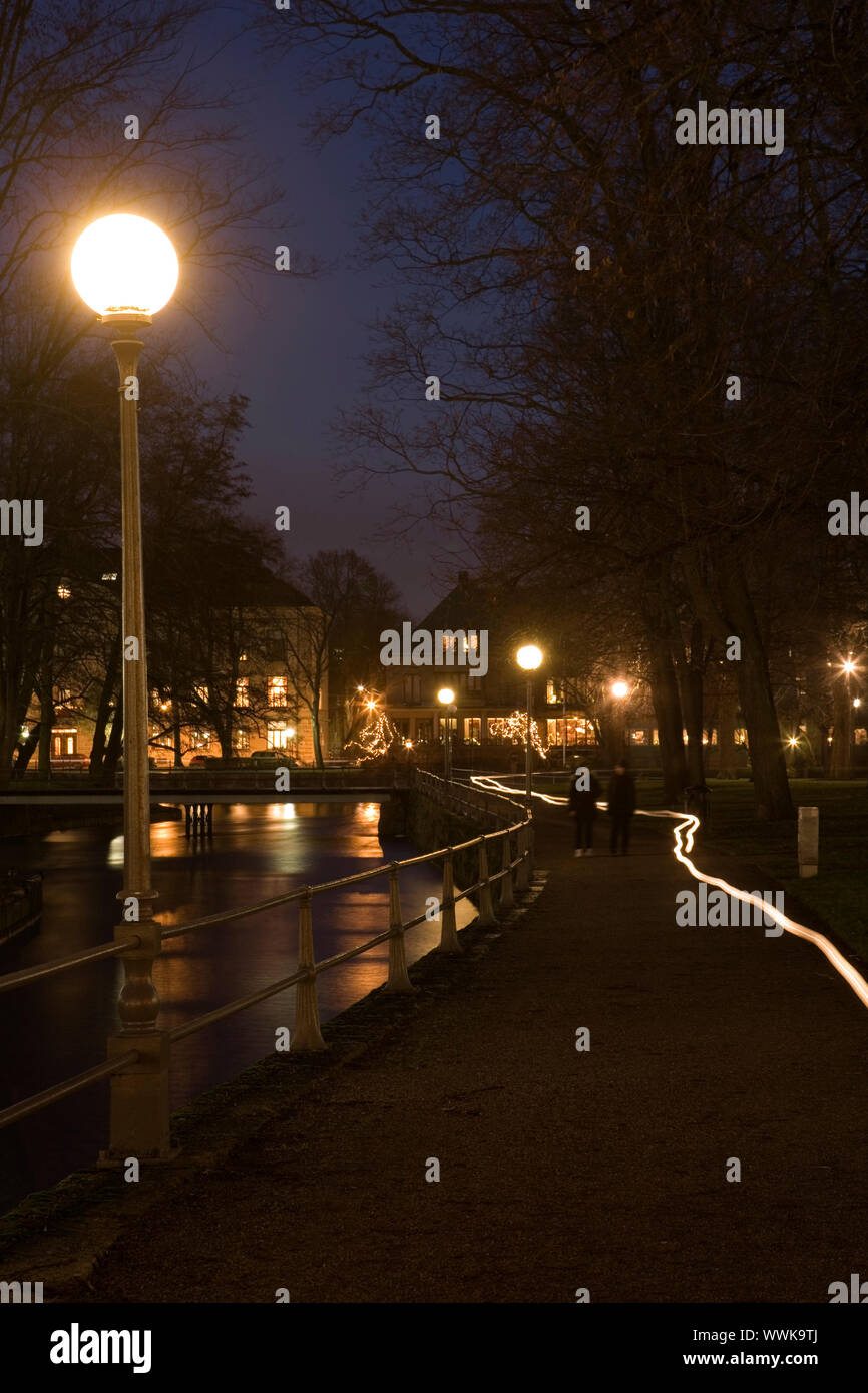 People walking in a park at night Stock Photo - Alamy