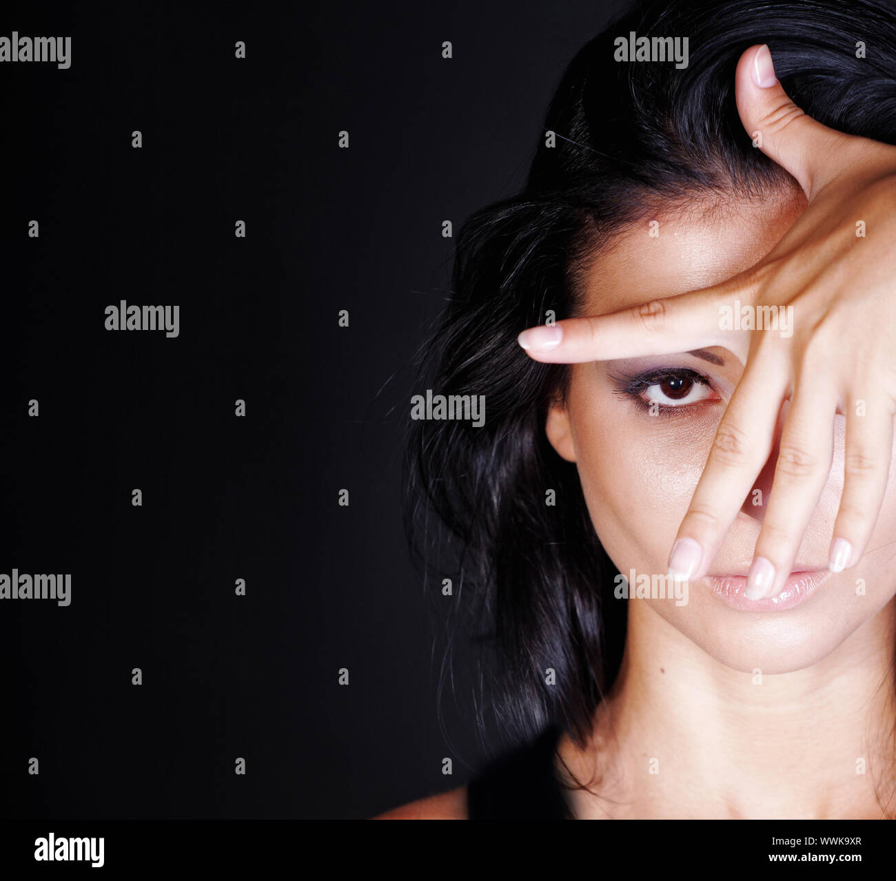 studio portrait of a beautiful brunette hiding face Stock Photo - Alamy