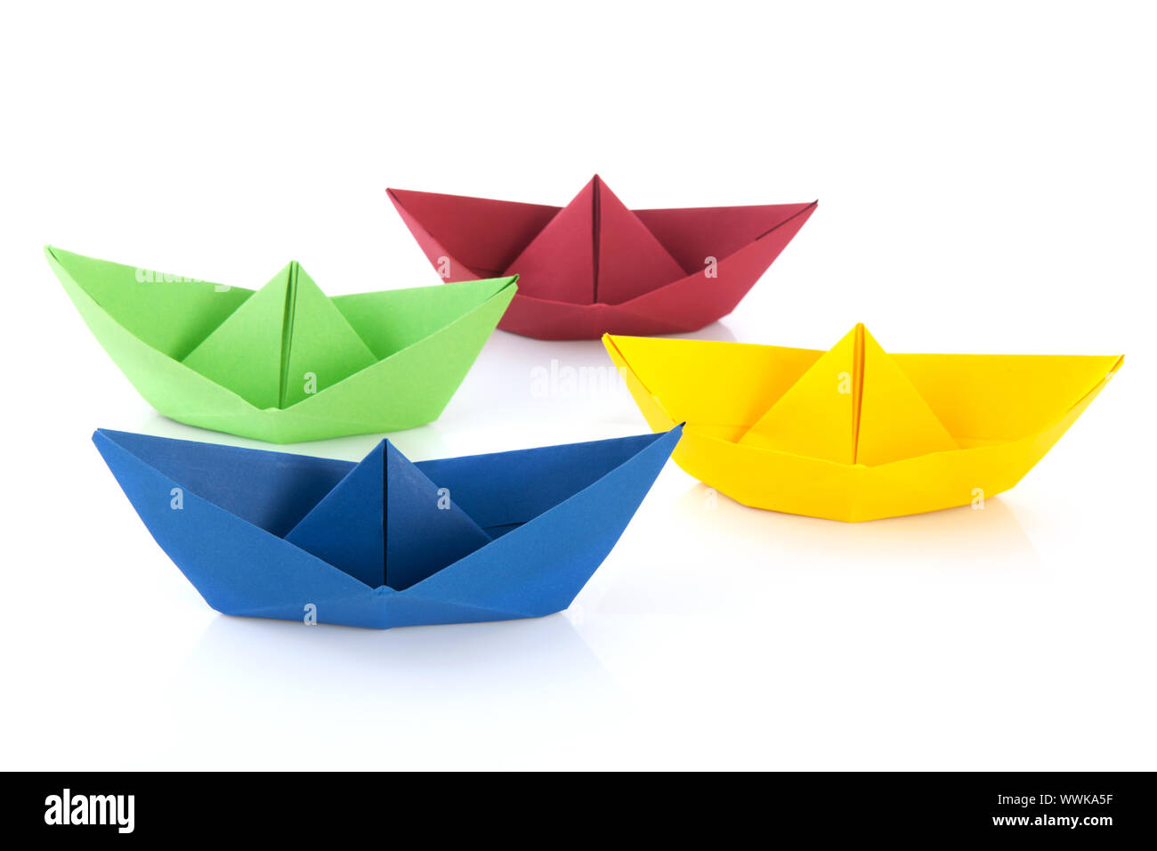 Colorful folded paper boats isolated over white background Stock Photo ...