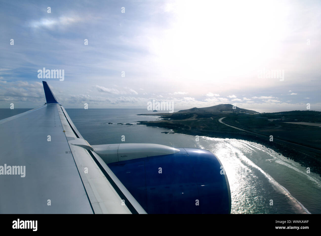 airplane fly in blue sky cloud around Stock Photo - Alamy
